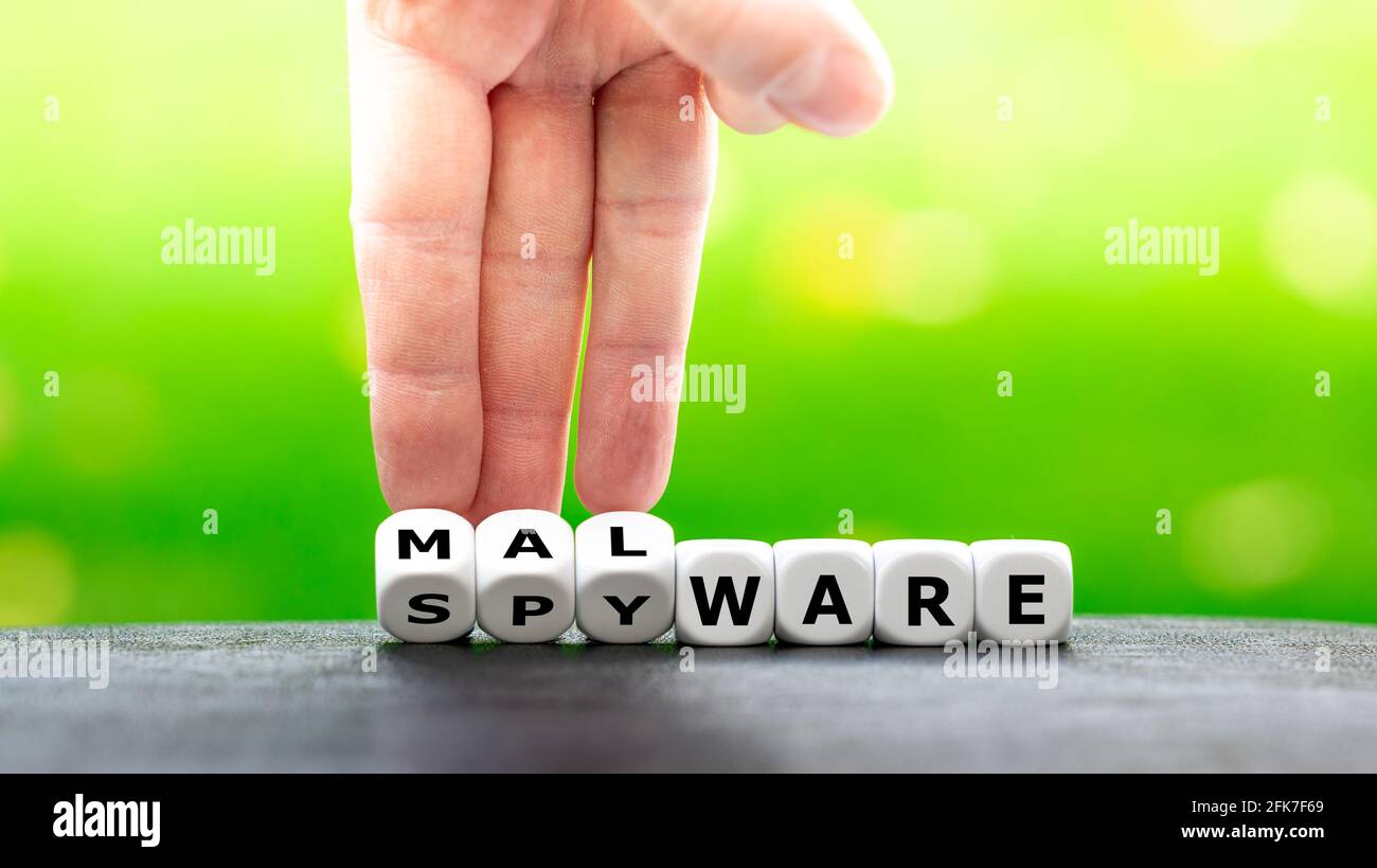 Dice form the words malware and spyware Stock Photo - Alamy