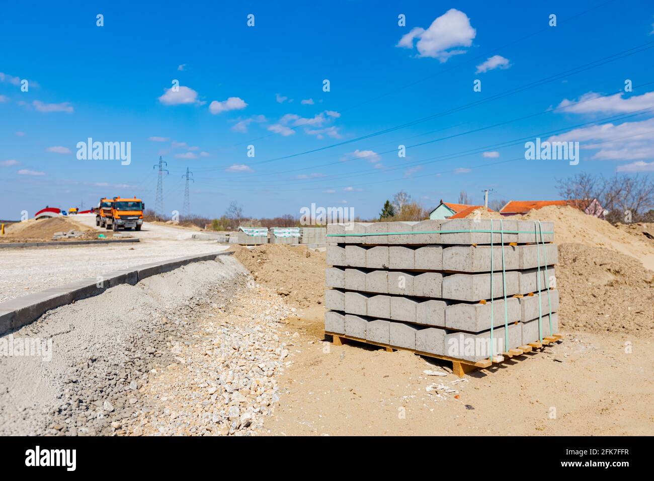 Stack of packed border stones for asphalt road on wooden pallet at ...