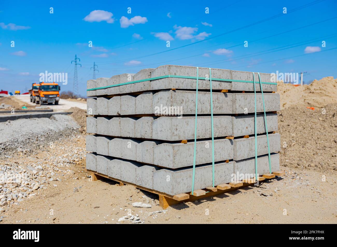 Stack of packed border stones for asphalt road on wooden pallet at ...