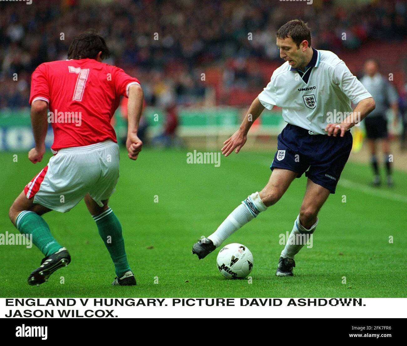 Jason Wilcox of England on his debut match beats a Hungarian defender ...