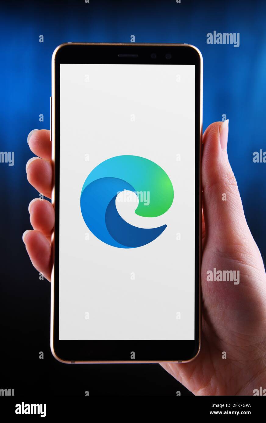 POZNAN, POL - FEB 6, 2021: Hand holding smartphone displaying logo of ...