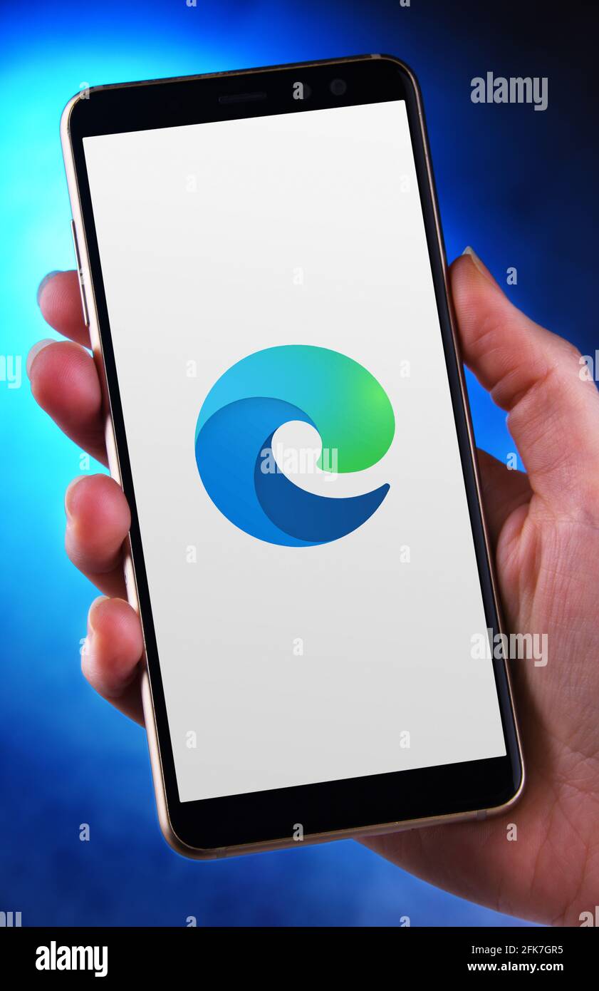 POZNAN, POL - FEB 6, 2021: Hand holding smartphone displaying logo of ...