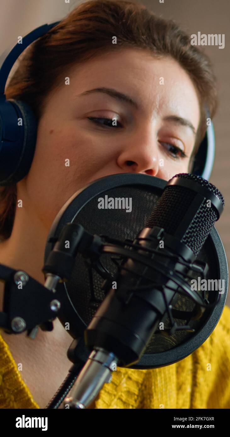Woman checking sound before recording hi-res stock photography and ...