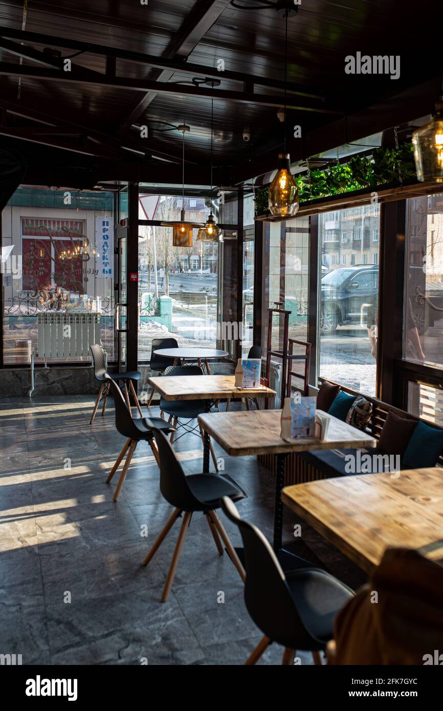 tables in a roadside cafe with a brick interior Stock Photo - Alamy