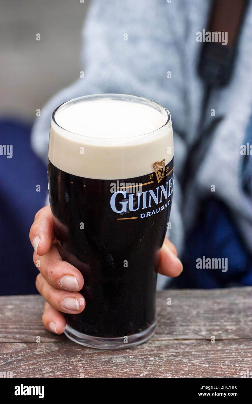 Cold and dark pint with guinness Stock Photo - Alamy