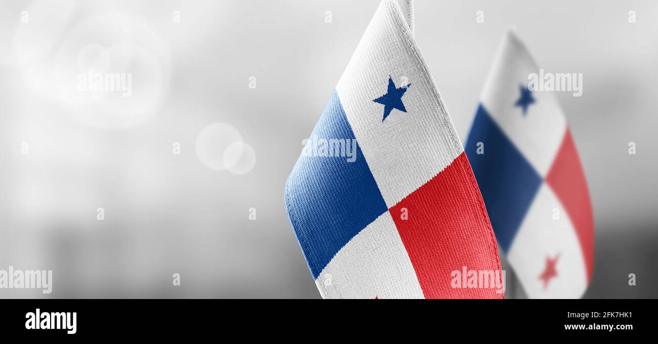 Small national flags of the Panama on a light blurry background Stock ...