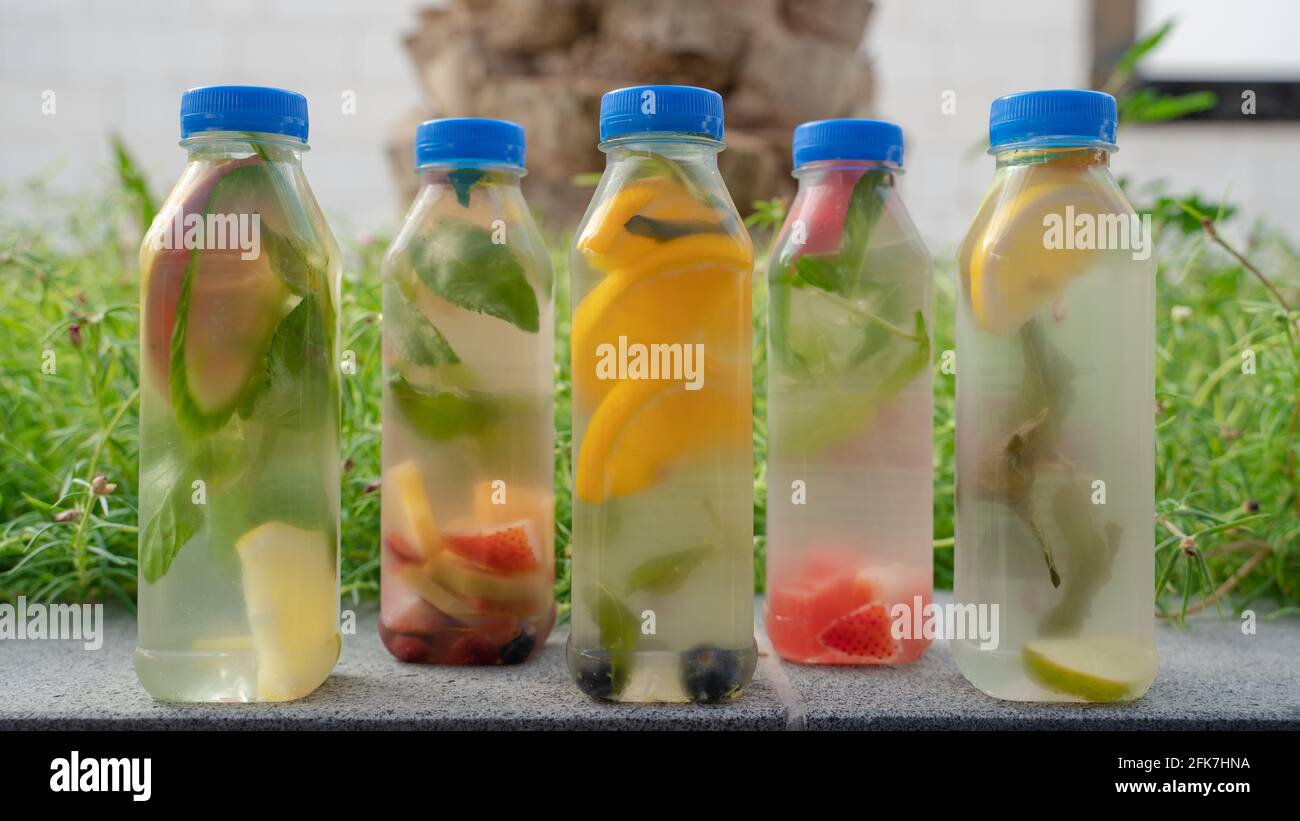 Variety of detox water on a plastic container, health concept Stock ...