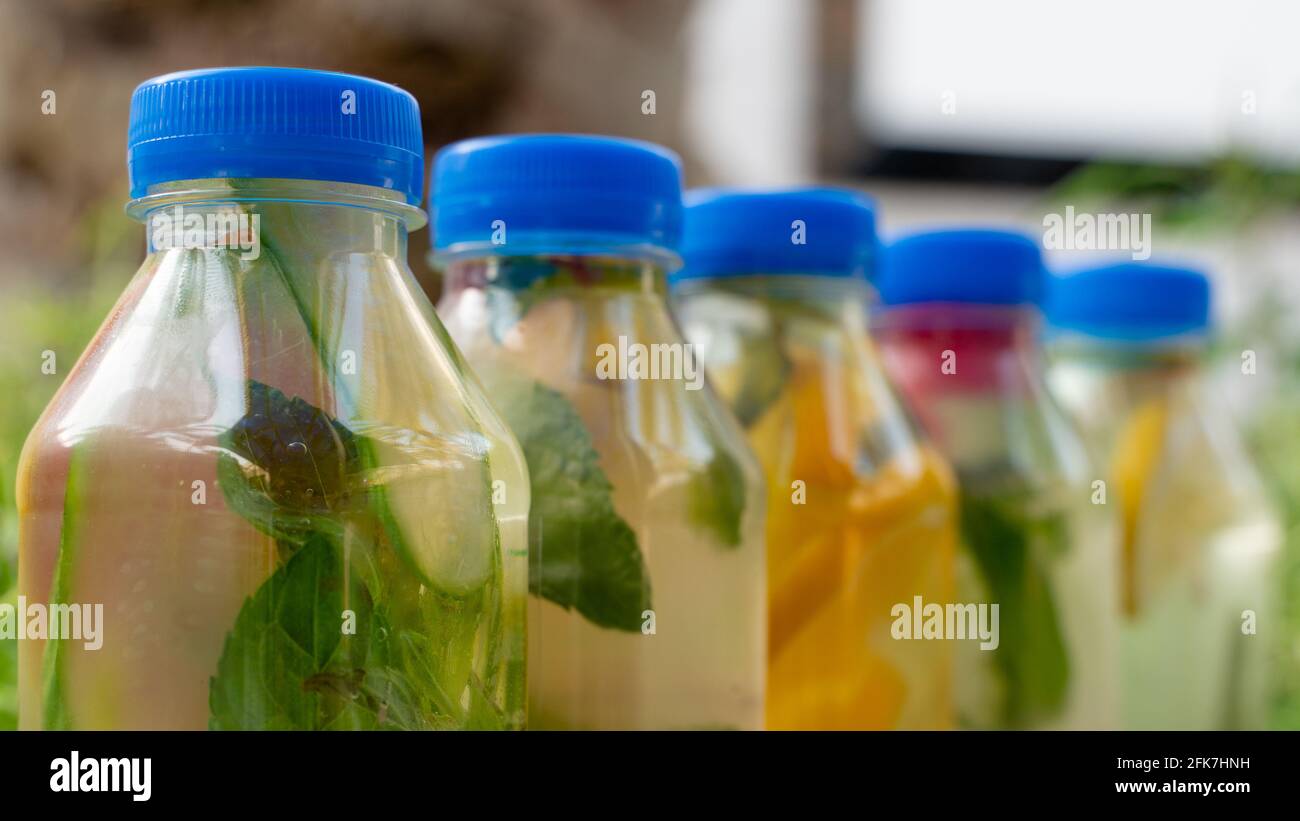 Variety of detox water on a plastic container, health concept Stock ...