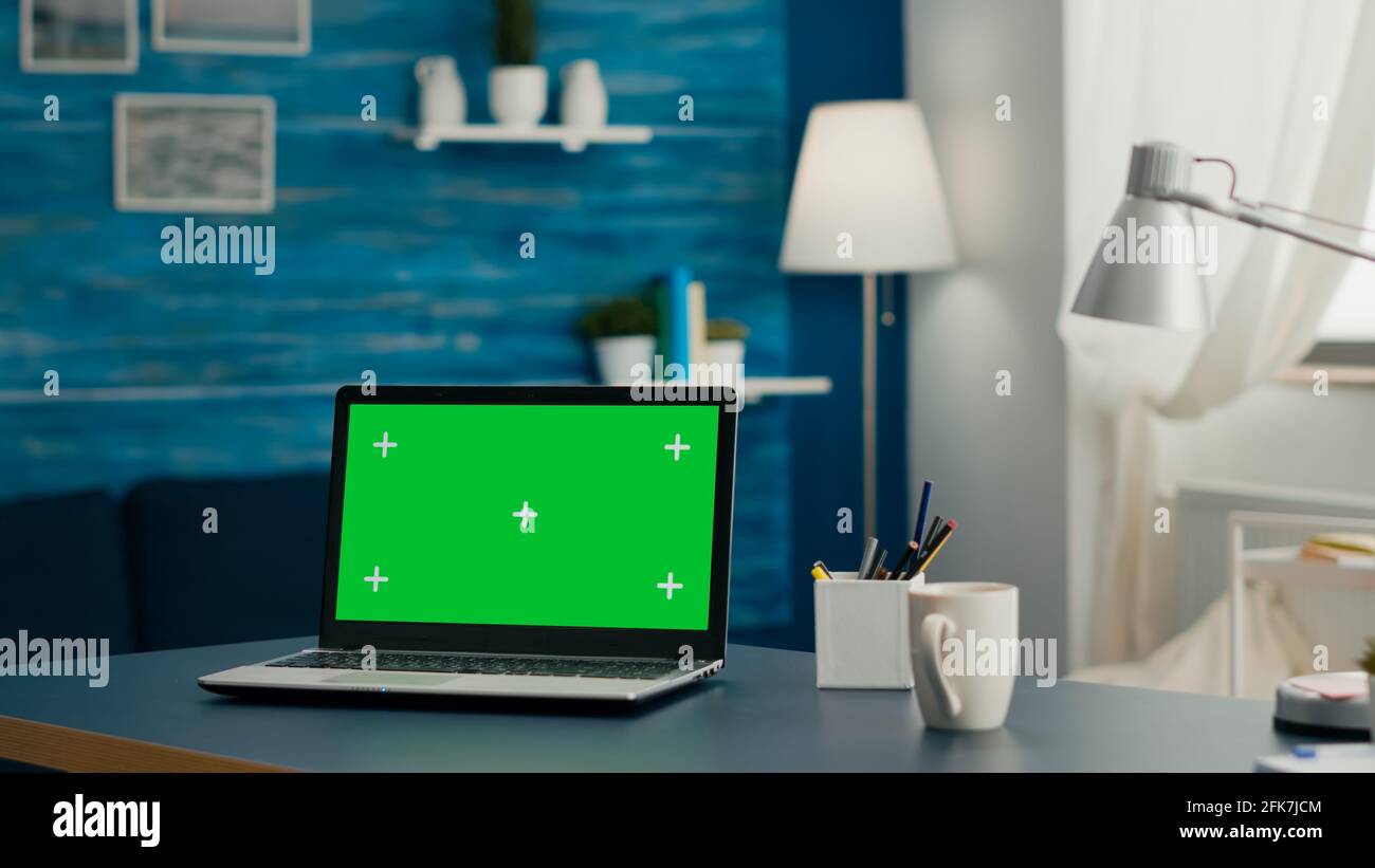 Laptop computer with mock up green screen chroma key display standing ...