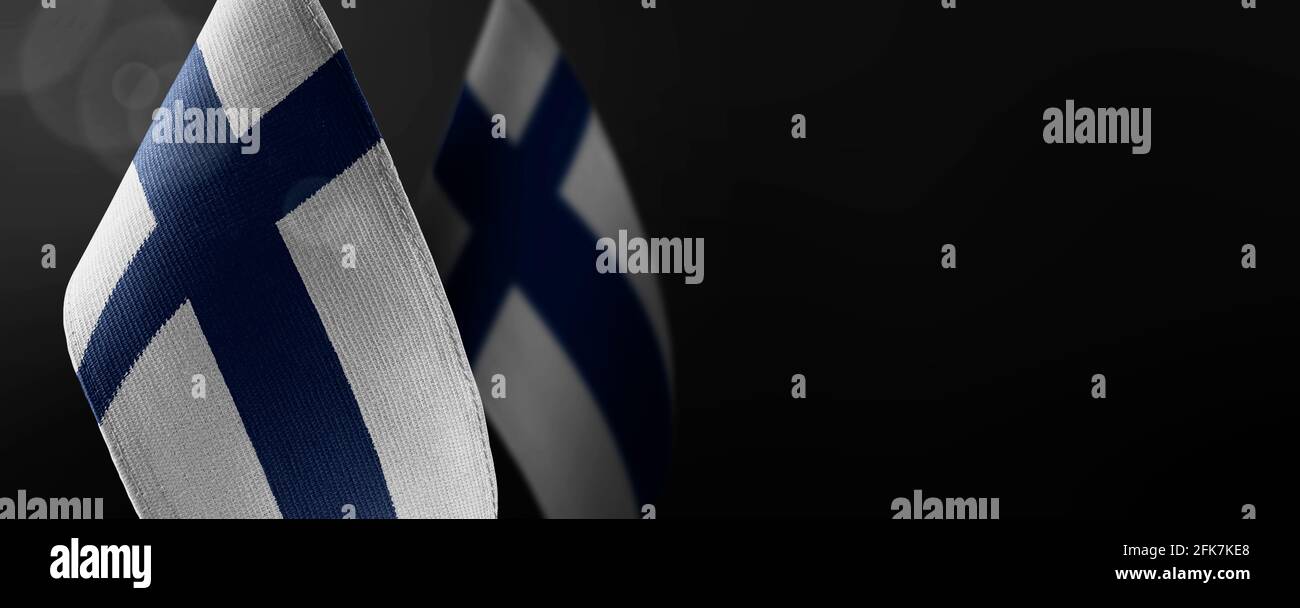 Small national flags of the Finland on a dark background Stock Photo ...