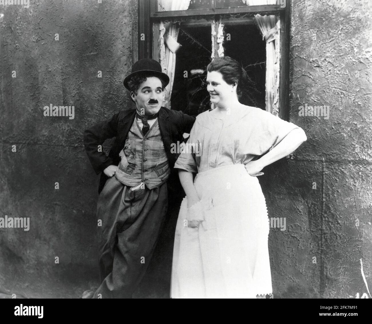 CHARLIE CHAPLIN in THE KID (1921), directed by CHARLIE CHAPLIN. Credit ...