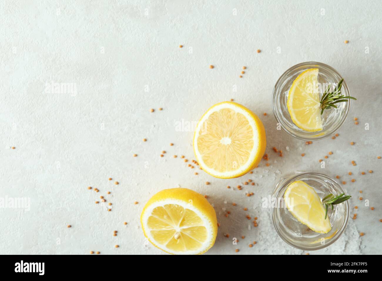Shots of tequila on white textured table Stock Photo - Alamy
