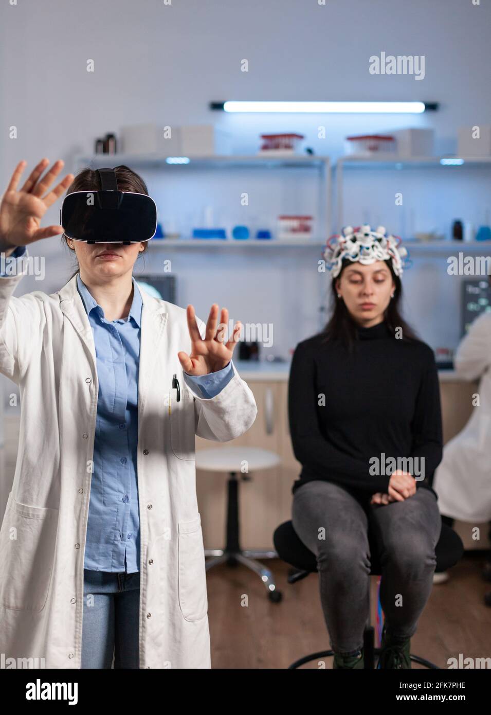 Laboratory doctor experiencing virtual reality using vr goggles in ...