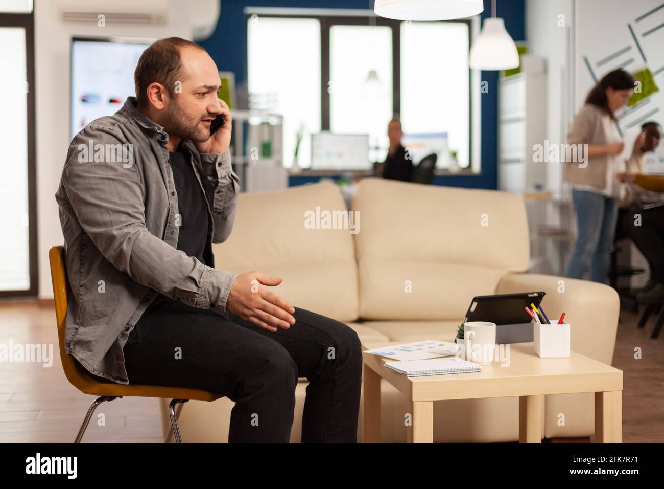 Nervous manager aggressively talking on phone and curses, screaming ...