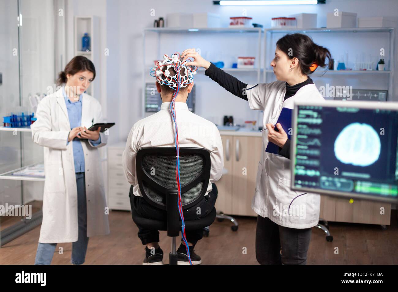 Patient wearing brainwave scanning headset hi-res stock photography and ...