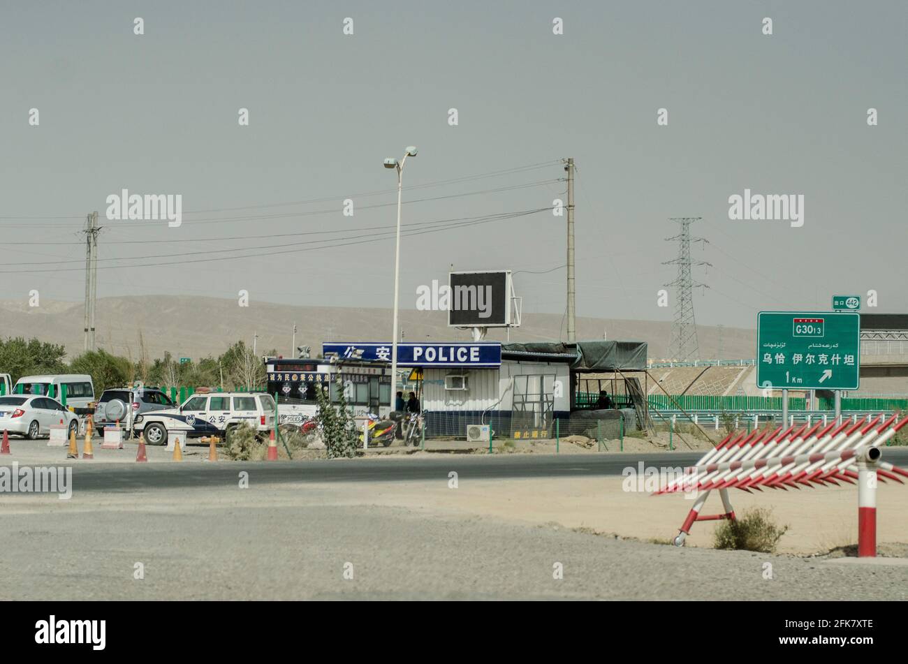 Police setup barriers and a security checkpoint on the road to control ...
