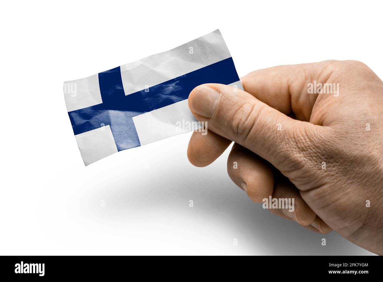 Hand holding a card with a national flag the Finland Stock Photo - Alamy