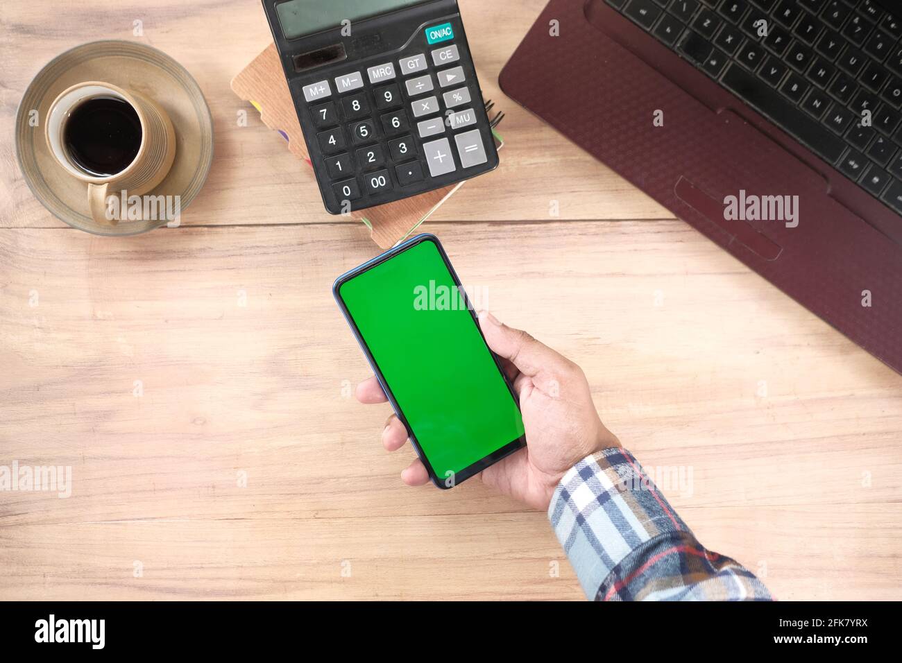 top view of man hand using smart phone on office desk Stock Photo - Alamy