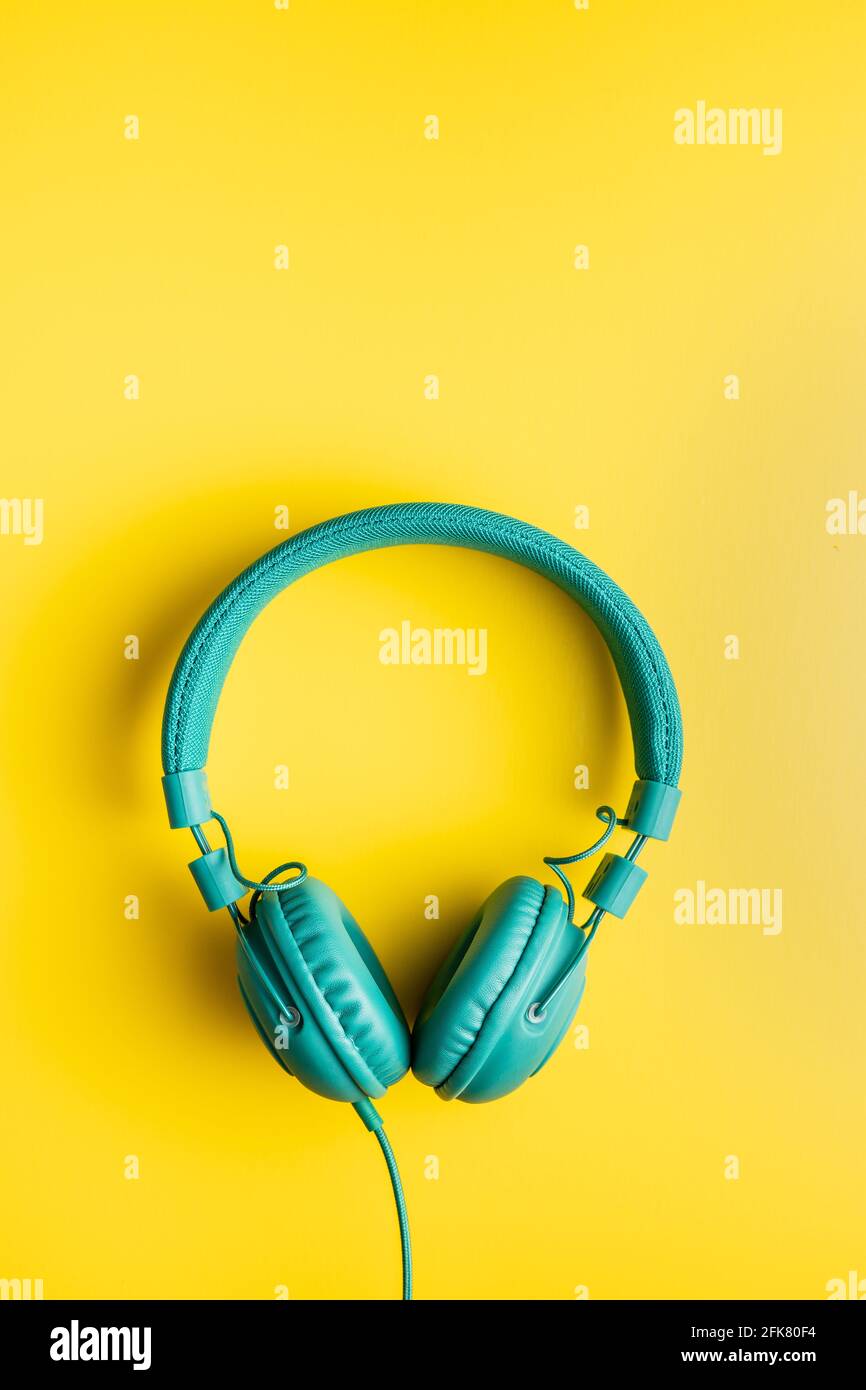 Colorful wired headphones on a yellow background. Top view Stock Photo ...