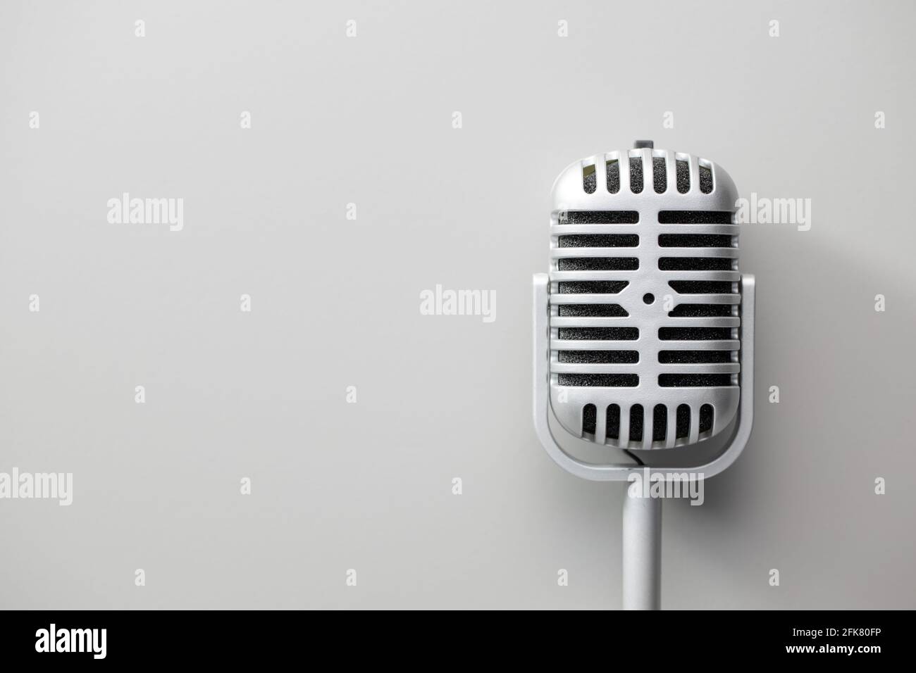 Metal retro microphone. Vintage microphone on gray background. Top view ...