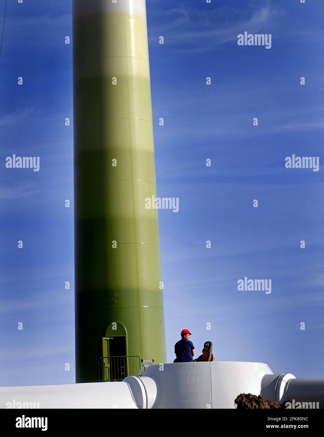 A worker during the construction of a wind turbine Stock Photo - Alamy
