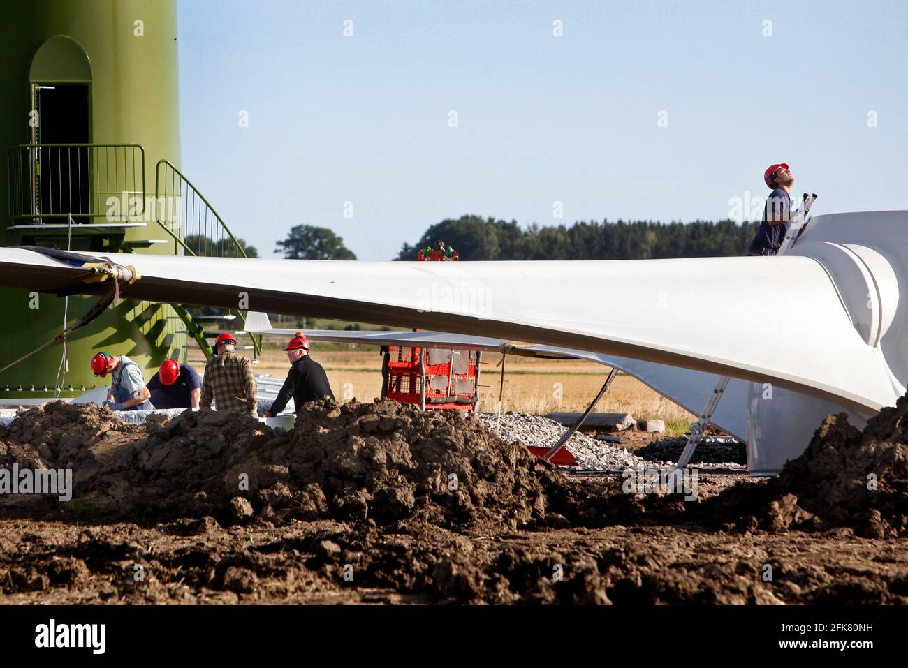 Workers during the construction of a wind turbine Stock Photo - Alamy