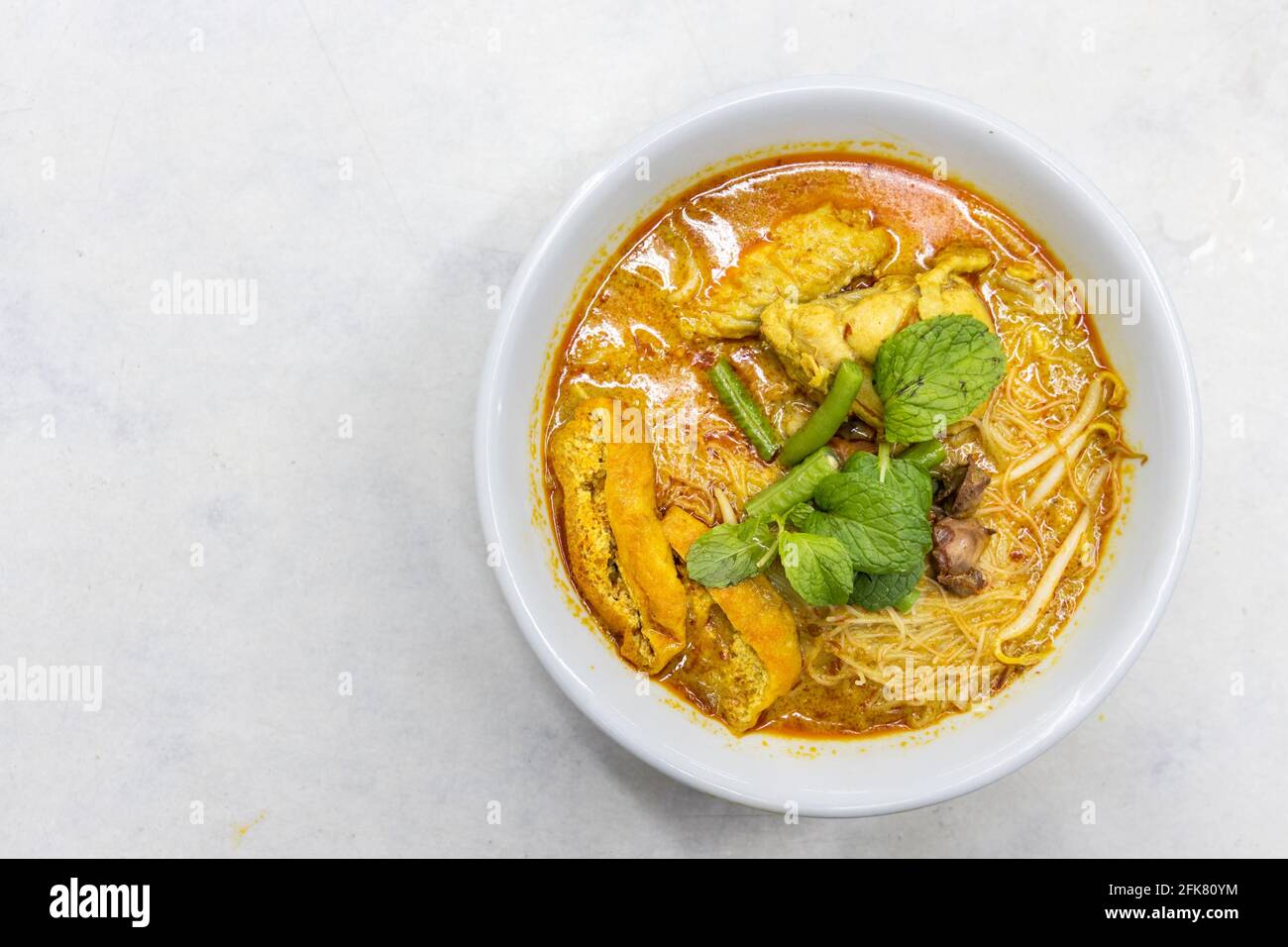 Overhead view of simple and delicious curry mee or noodle, popular ...