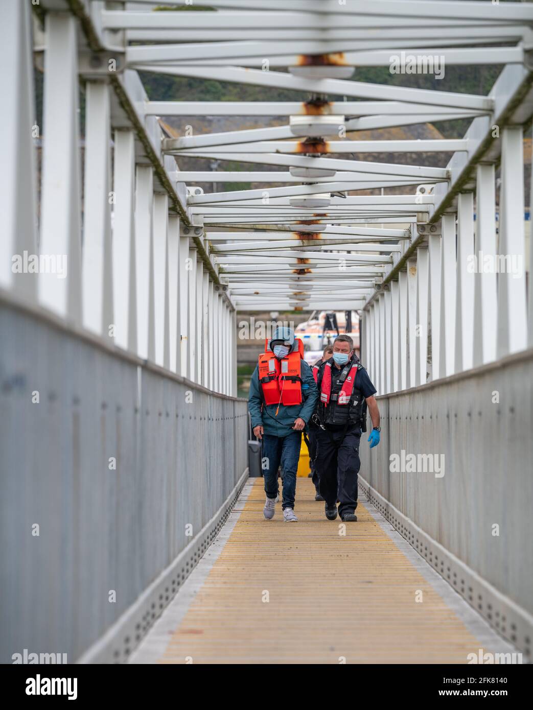 Migrants picked up off the coast of Dover are brought to the harbour ...
