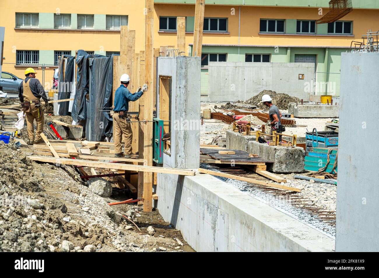 Civil Engineer inspecting and instructing construction workers on the ...