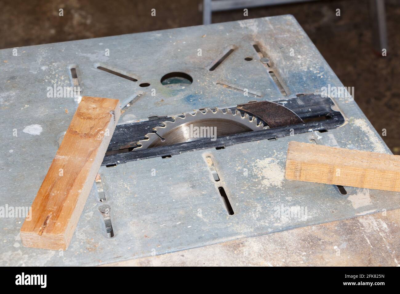 Circular saw table with pieces of wood tu cut Stock Photo - Alamy