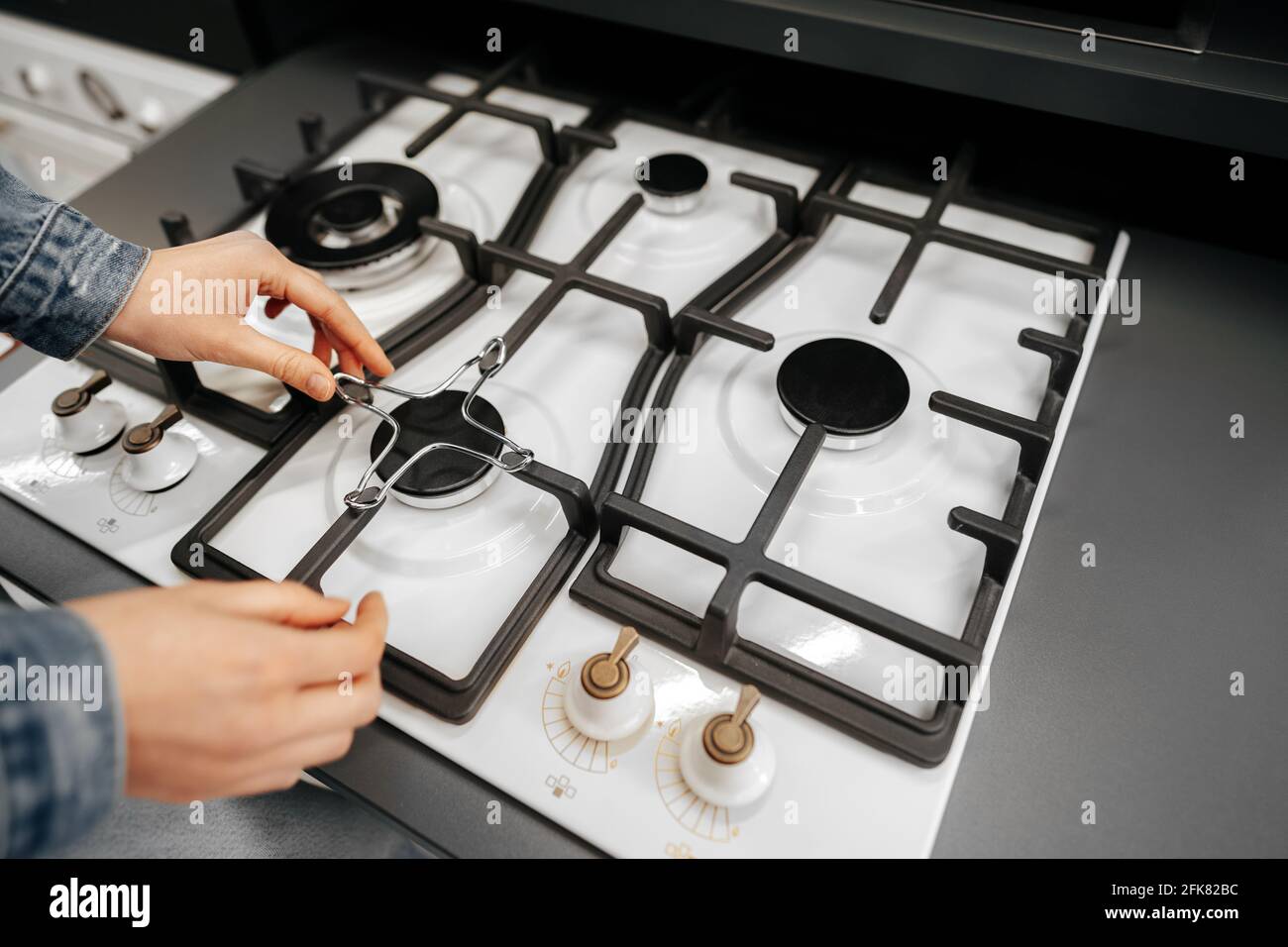 Hand checking stove hi-res stock photography and images - Alamy