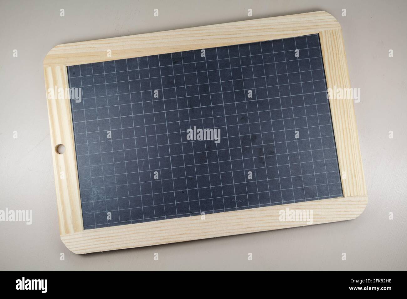 Chalkboard slate with grid pattern for schoolchild Stock Photo - Alamy