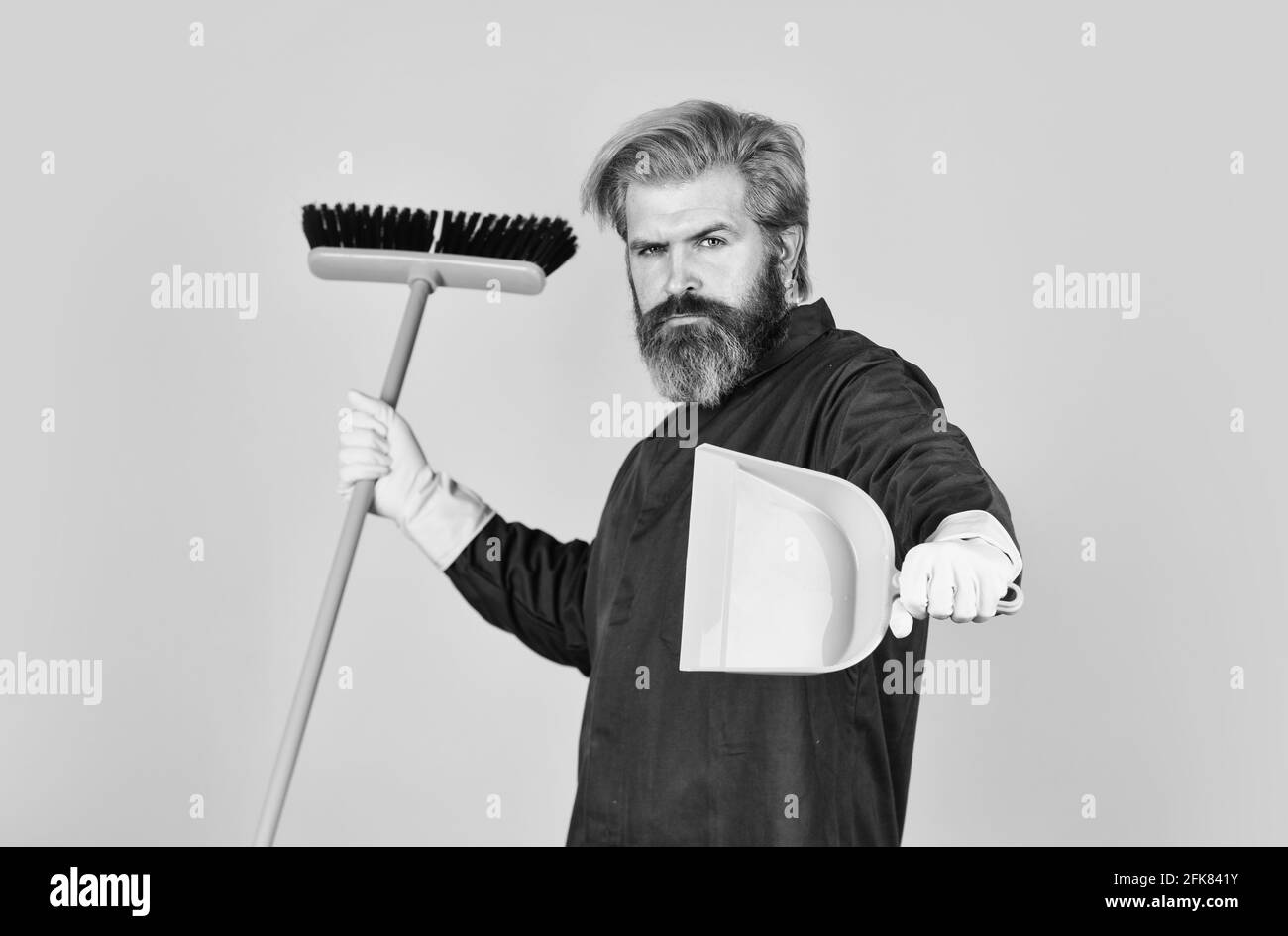 Garbage removal. Cleaning day. Cleaning agency. Worker with brush ...