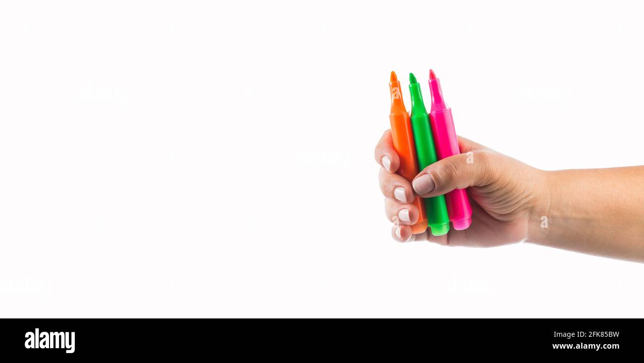Hand holding colored highlighters - White background Stock Photo - Alamy