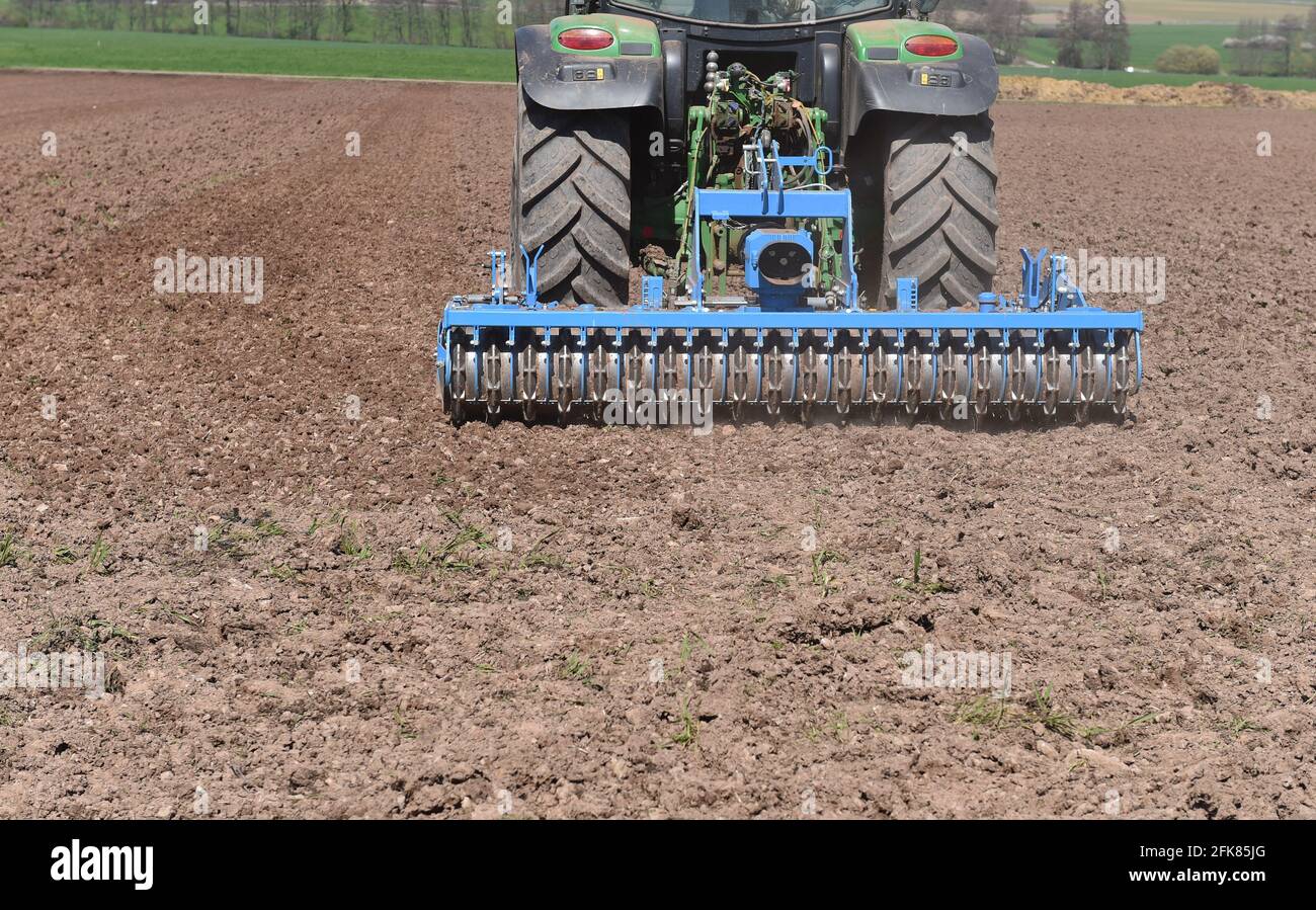 Tractor With Roller Harrow Stock Photo - Alamy