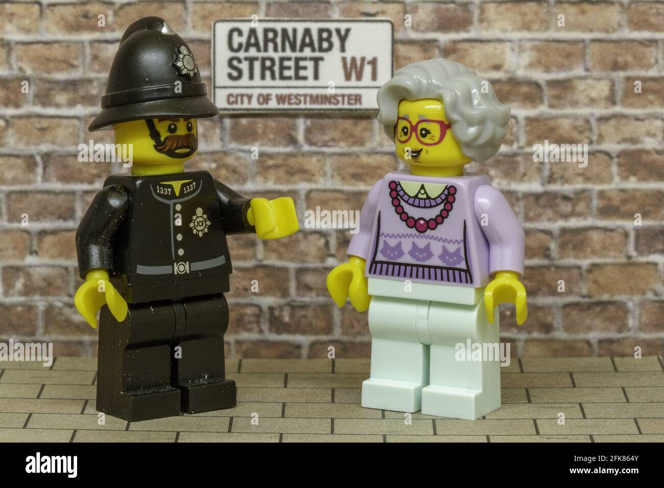 LONDON, UNITED KINGDOM - Jul 15, 2018: A policeman giving directions to ...