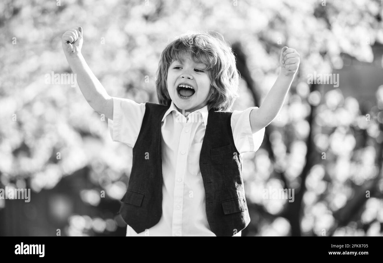 Excited kid. Adorable boy spring garden. International childrens day ...