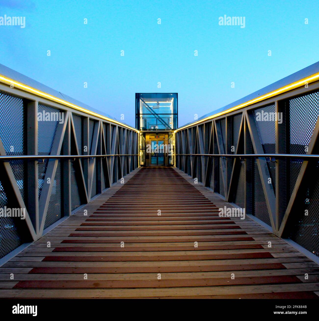 A bridge leading to a elevator Stock Photo - Alamy