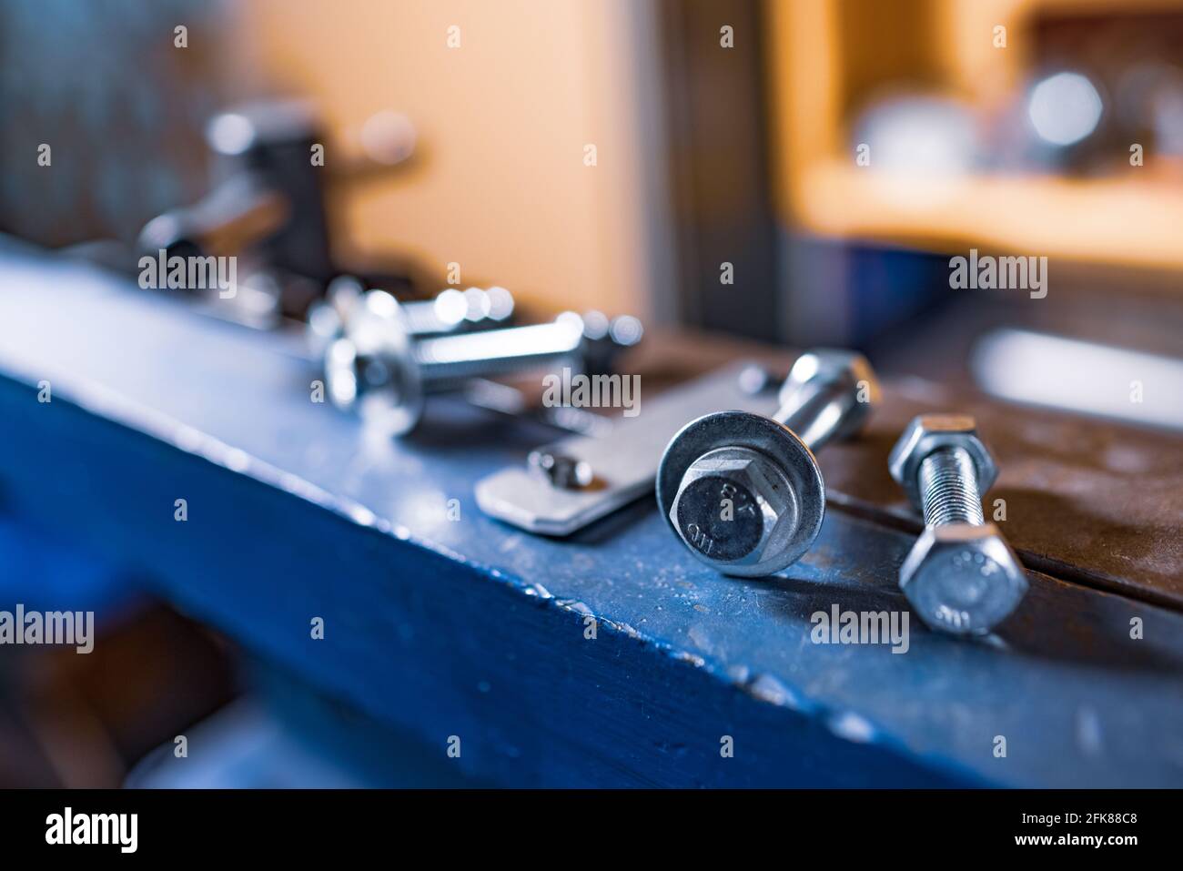 Metal chrome bolts and nuts on manual flexible massive machine. Old ...