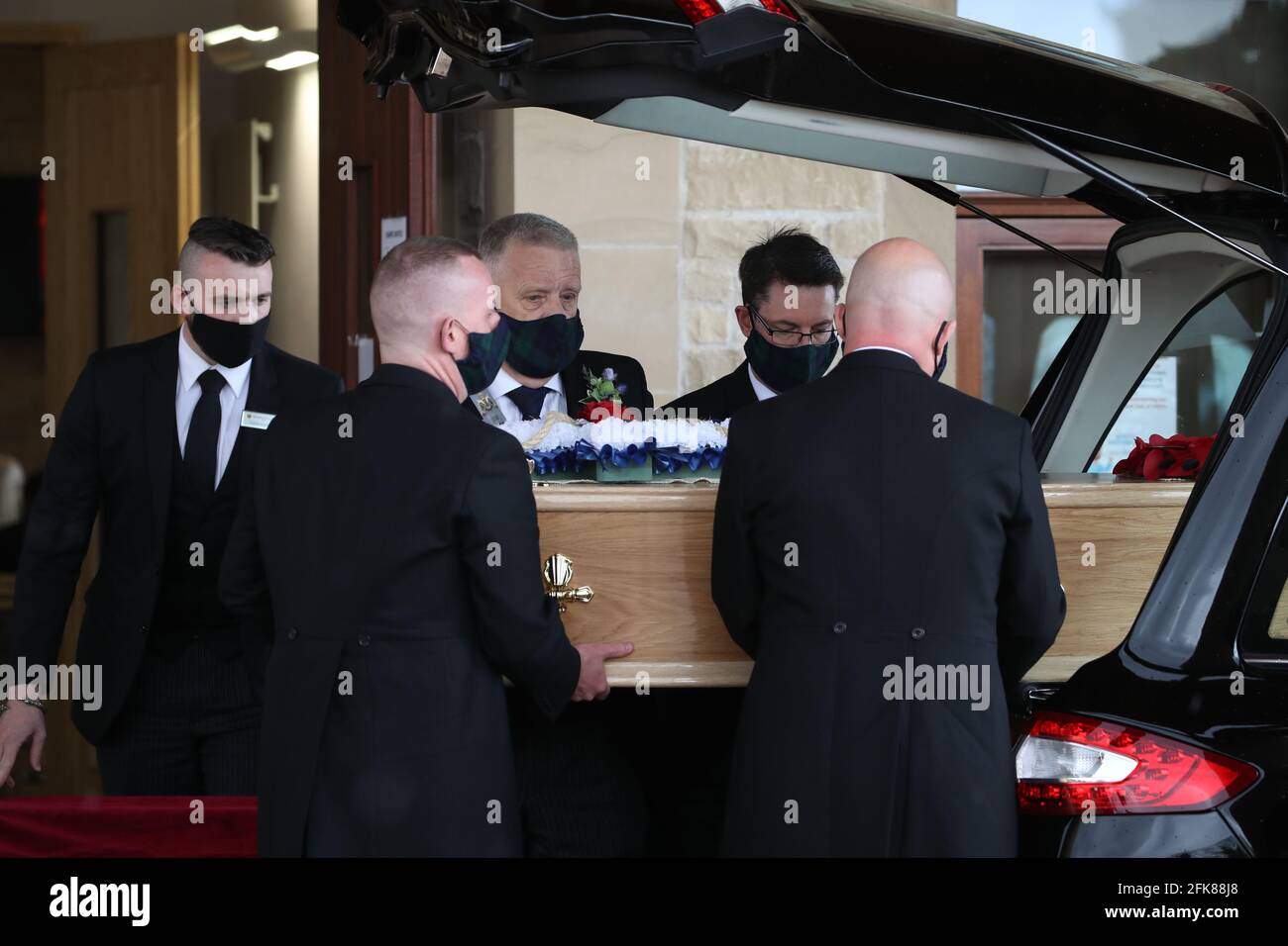 The coffin is lifted from the hearse at Stirling Crematorium, for the ...