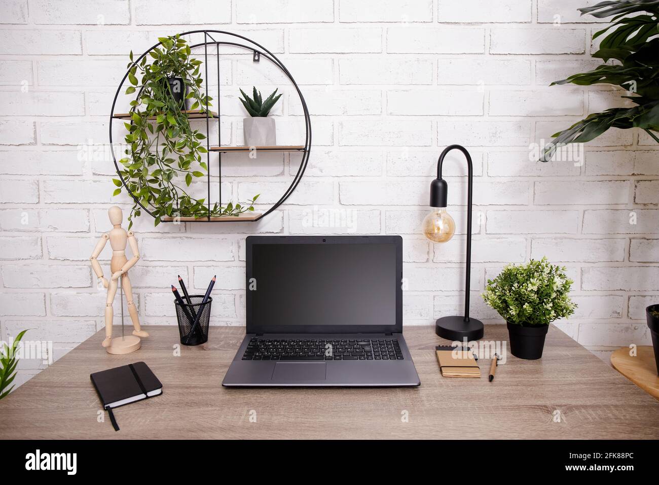 Modern laptop with blank screen on the table in office Stock Photo - Alamy