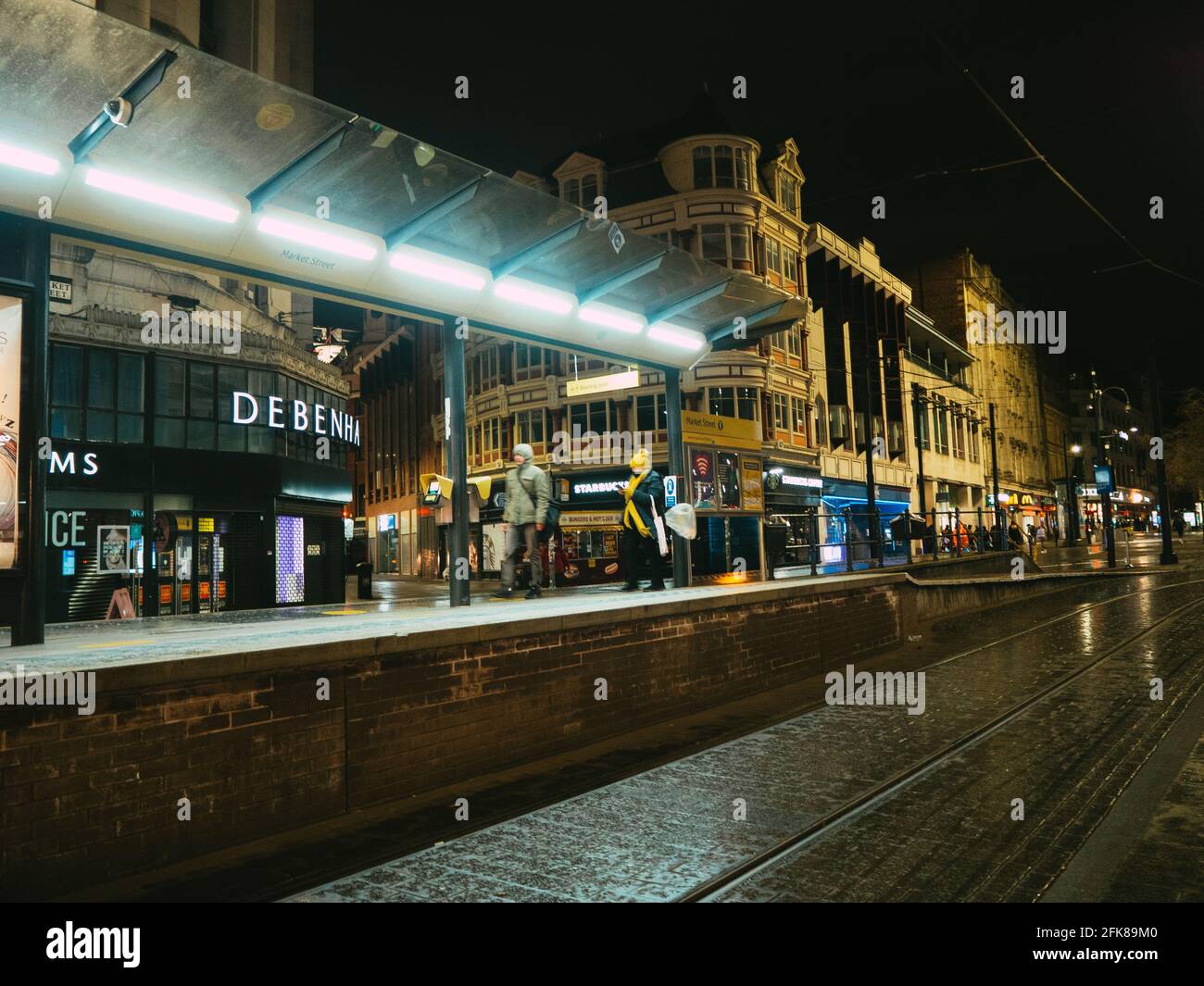 Metrolink tram and passengers at night hi-res stock photography and ...