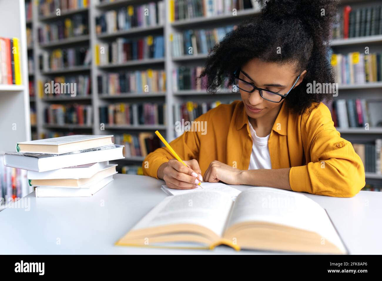 College girl writing note hi-res stock photography and images - Alamy