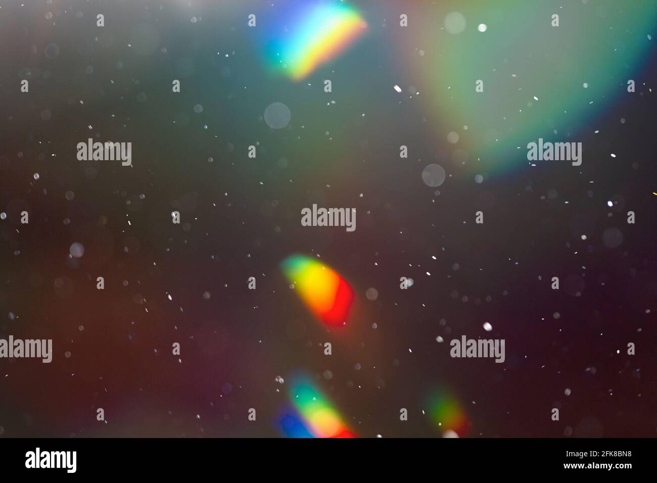 Dust particles and lens flare on a black background Stock Photo - Alamy