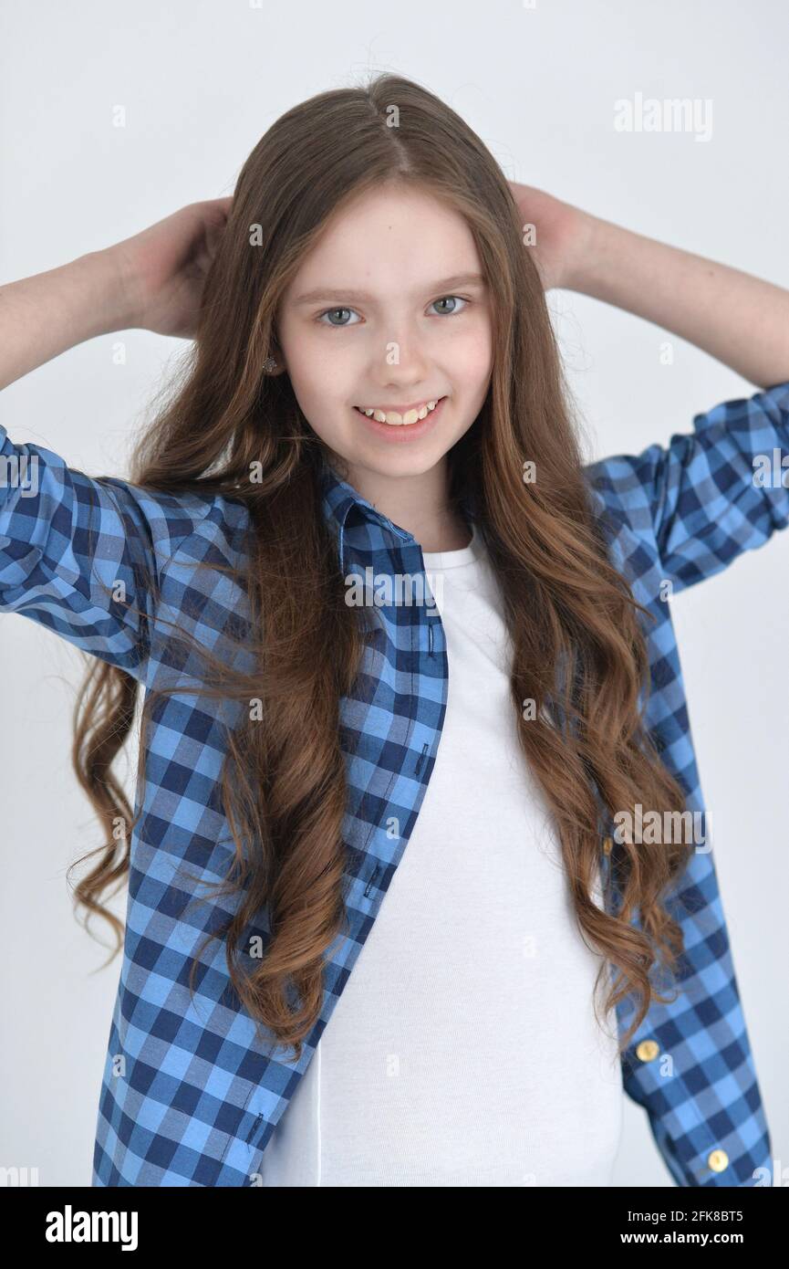 Cute girl looking at camera isolated on white background Stock Photo ...