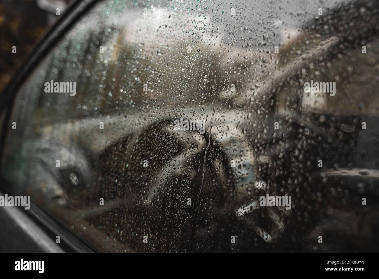 Raindrops in car window hi-res stock photography and images - Alamy
