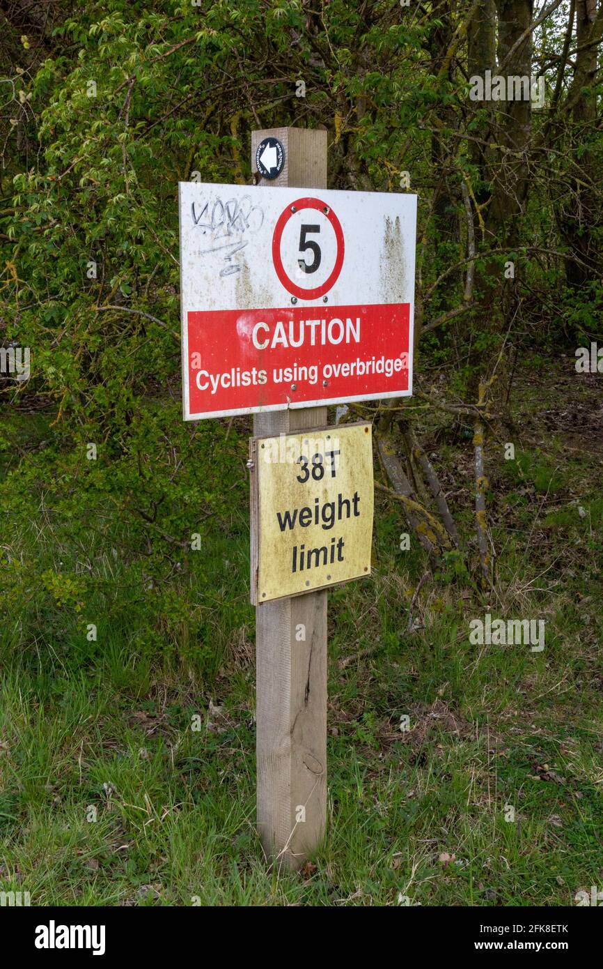 A five miles per hour speed limit sign for a bridge going over a ...