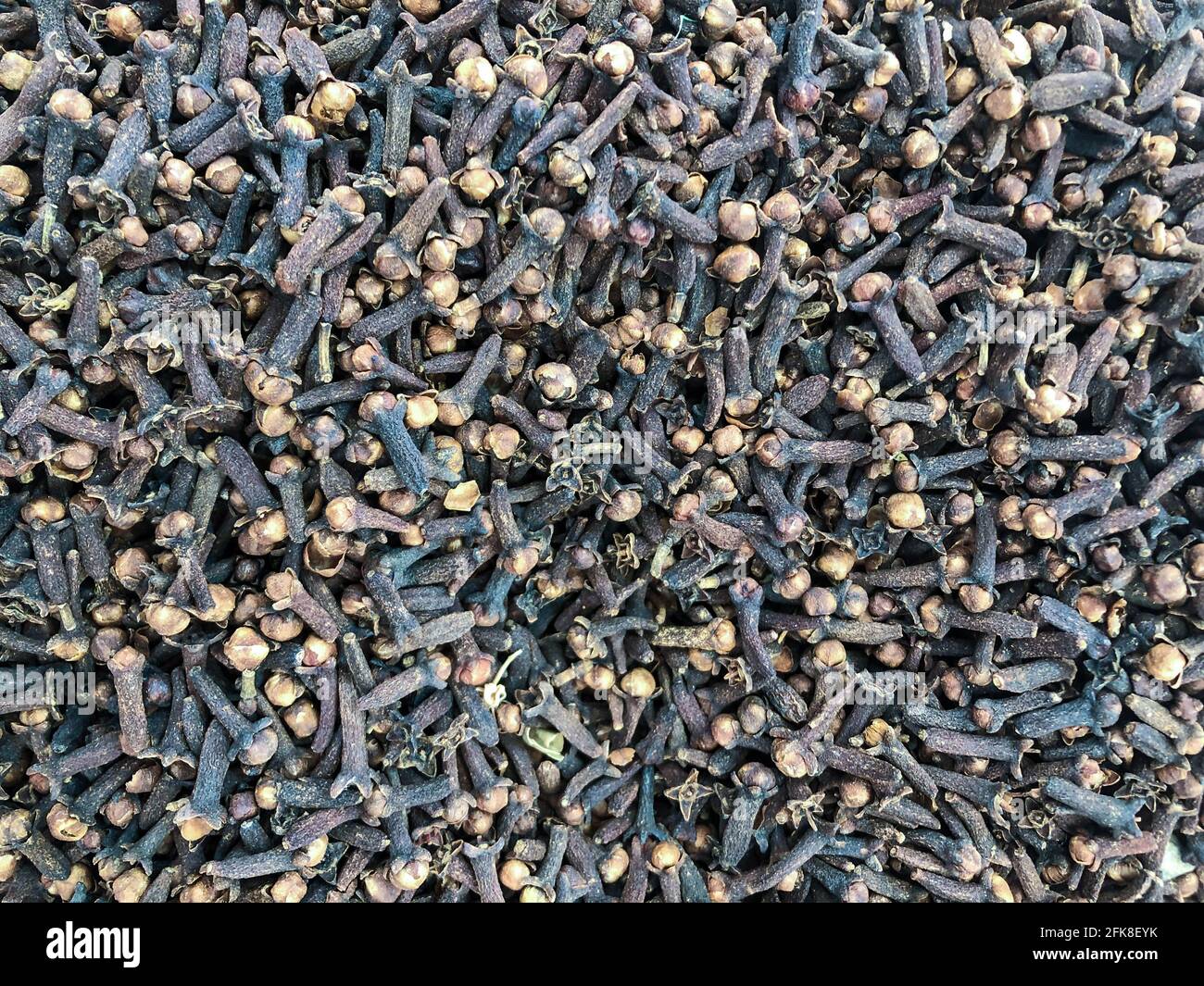 pile of dried clove spice as a background Stock Photo - Alamy