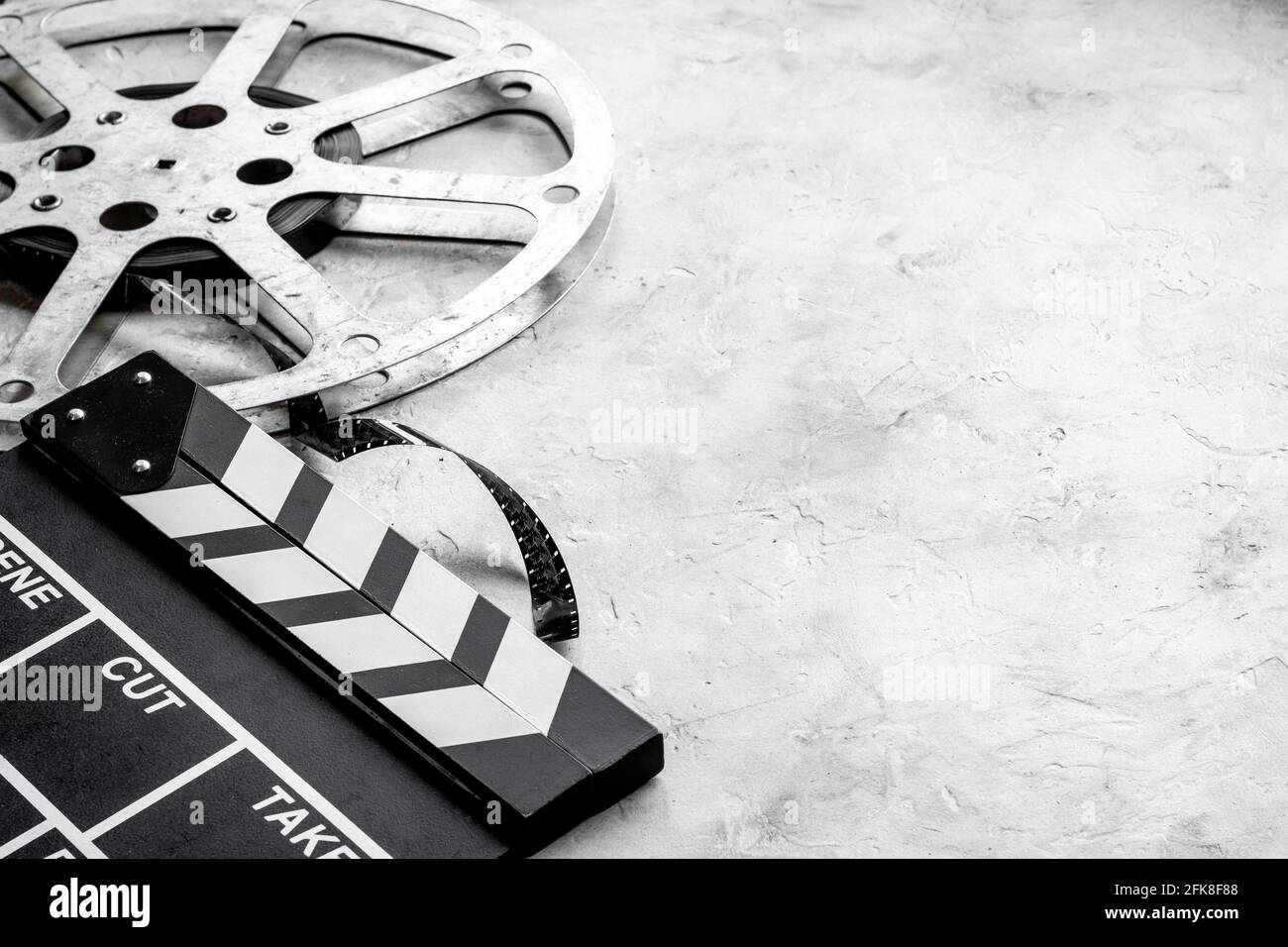 Motion picture film reel with movie clapper. Cinema concept Stock Photo ...