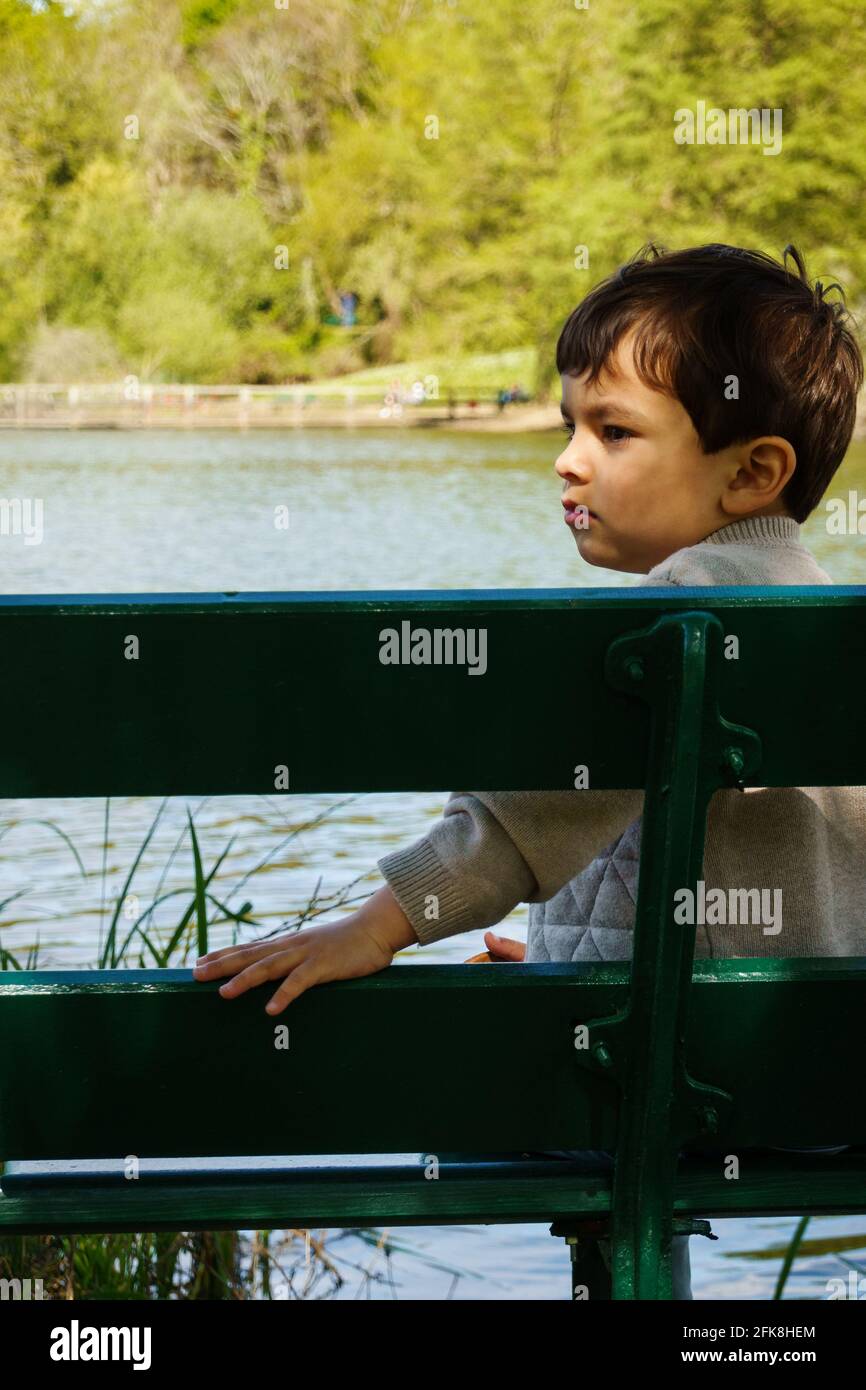 Boy sitting on the bench hi-res stock photography and images - Alamy